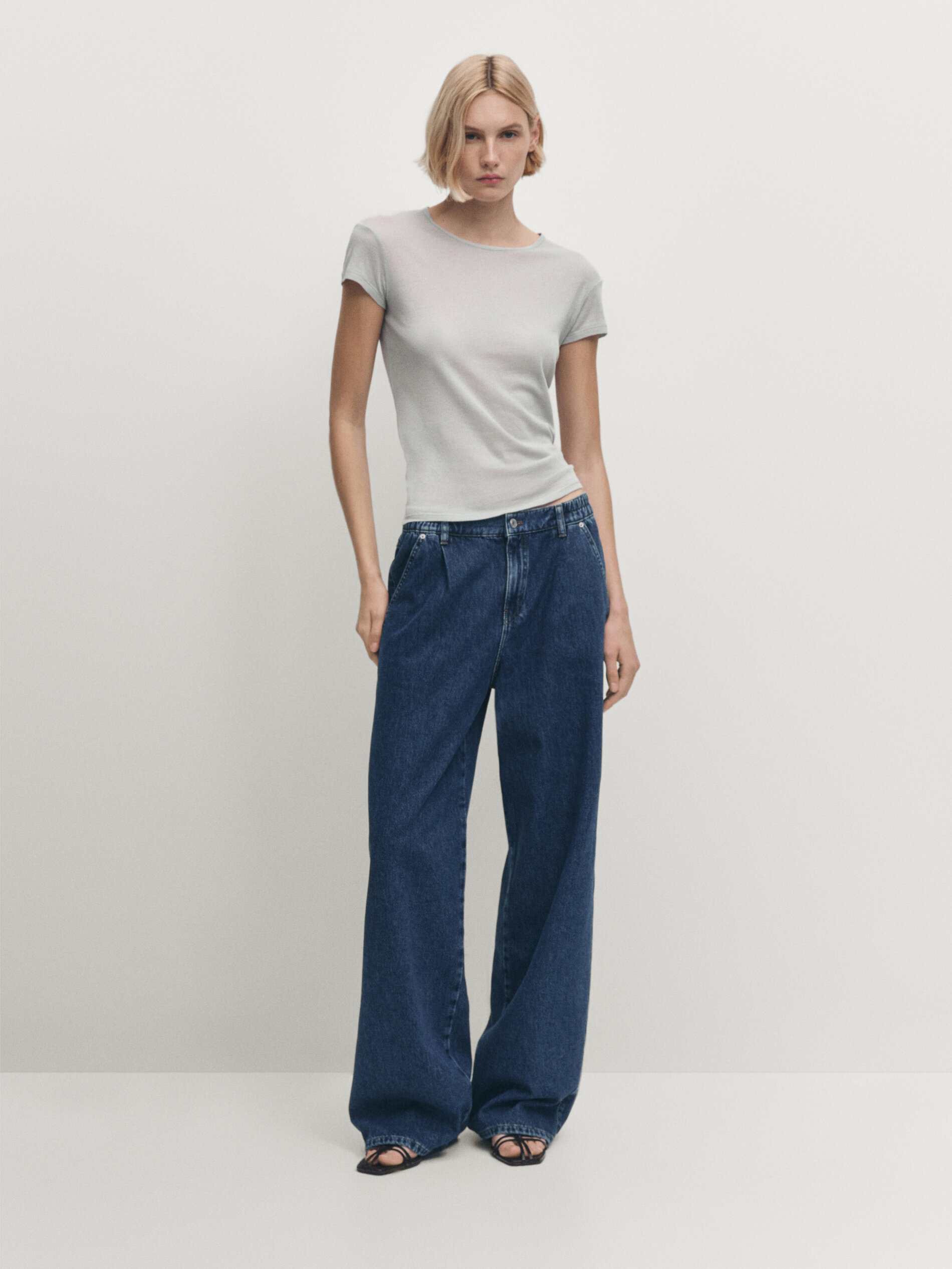 بنطلون جينز رياضي بساق عريضة ولون مغسول متوسط · أزرق متوسط · Dressy ...